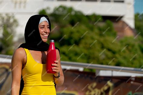Premium Photo Portrait Of Muslim Woman Wearing Hijab Drinking Water