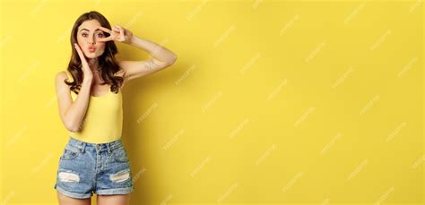 Premium Photo Beautiful Glamour Girl In Summer Outfit Showing Peace
