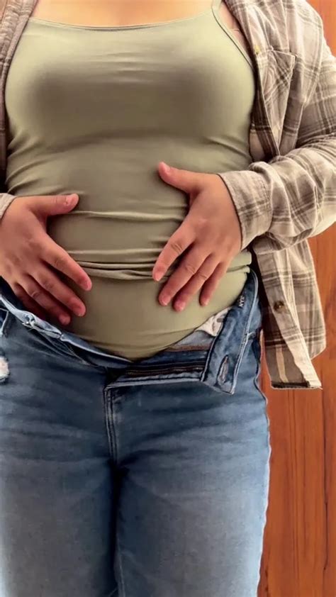 A Girl Tries To Button Her Jeans Stock Video Pond5