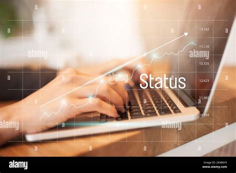 Female Analyst At Her Desk Works On A Laptop Showing Statistics Graphs