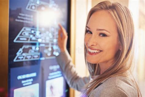 Travel Made Easy A Young Woman Using An Interactive Hotel Map Stock