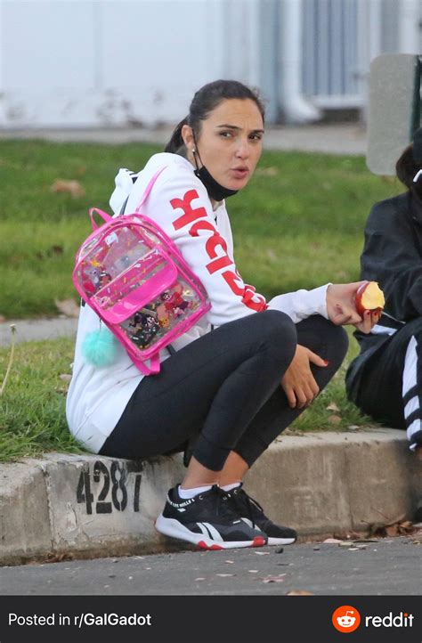 Gal Gadot Sitting On The Sidewalk Looking Like A Street Hooker Wholl