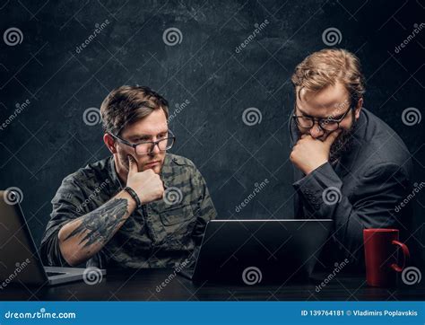 Two Programmers Are Thinking Hard Trying To Find A Solution To The