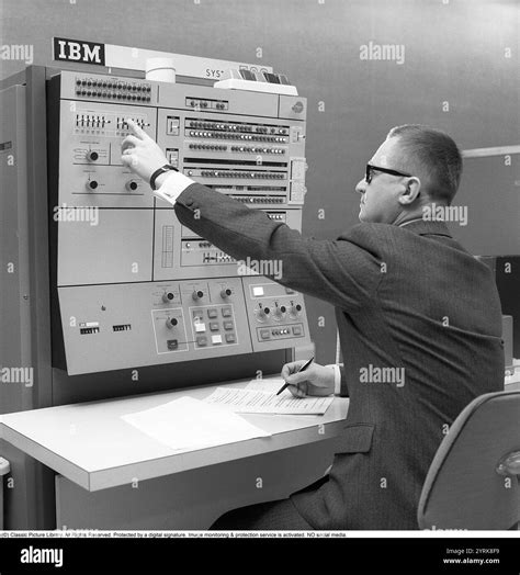 In The 1960s Interior Of A Room With Computers And People On The Job