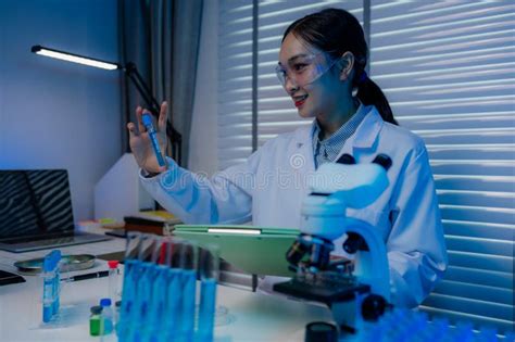 A Female Scientist Is Experimenting With Chemicals In A Lab Science Experiments Often Require A