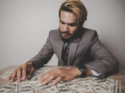 Premium Photo Young Man Sitting At Table