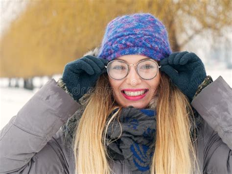 Beautiful Happy Girl In The Cold In A Blue Hat And Round Glasses Stock