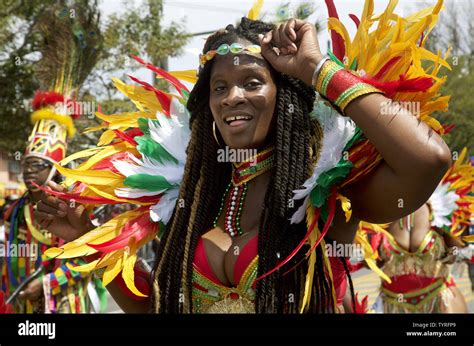 A Women Wearing A Tribal Outfit Participates In The Annual West Indian