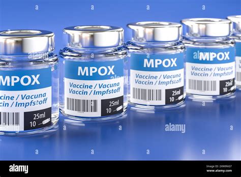 Vials Of Vaccine Against Mpox The Word Vaccination In English Spanish