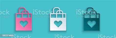 파란색 배경에 고립 된 하트 아이콘이있는 종이 컷 쇼핑 백 쇼핑백 가게는 하트 아이콘처럼 사랑해요 해피 발렌타인 데이 종이 아트 스타일 벡터 3차원 형태에 대한 스톡 벡터