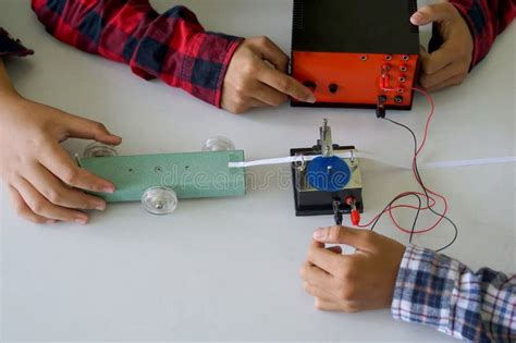 Science Classroom Students Are Conducting A Physics Experiment On The Speed Of Objects Using A Science Classroom Students Are Conducting A Physics Experiment On The Speed Of Objects Using A