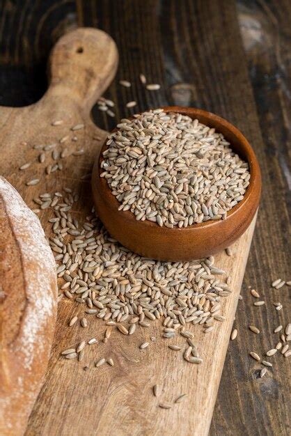 Premium Photo Rye Grain For Making Flour And Bread A Large Amount Of Rye Grain In A Wooden Bowl