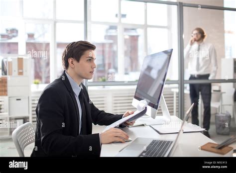 Checking Banker Hi Res Stock Photography And Images Alamy