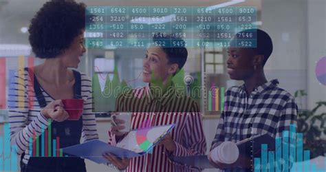 Team Examining Business Charts In Office As Mug Raising Triggers