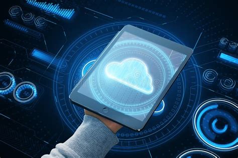 Close Up Of Hand Holding Tablet With Glowing Cloud Computing Hologram On Dark Background Stock