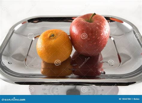 Apple And Orange Genetically Modified Symbiosis Isolated On White