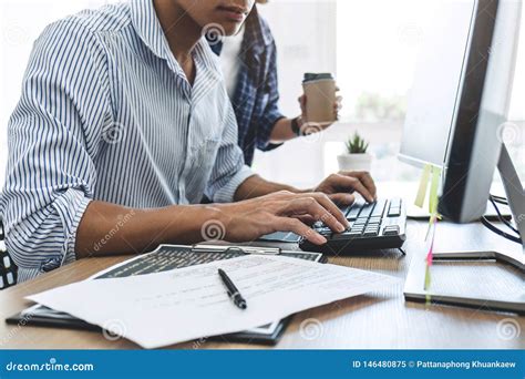 Two Professional Programmers Cooperating At Developing Programming And Website Working In A