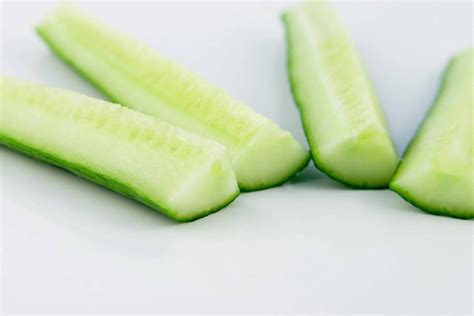 Download Horizontally Sliced Green Cucumber Fruits Wallpaper