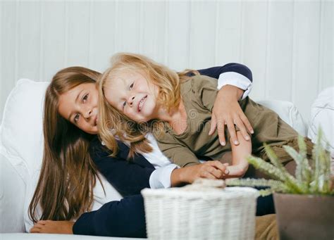 Two Cute Sisters At Home Playing Stock Image Image Of Holding