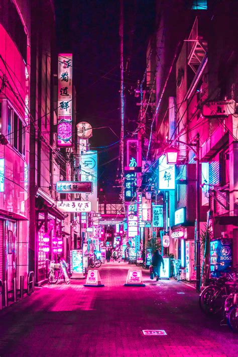 Download Cruise Through The Dazzling Neon Cityscape Wallpaper