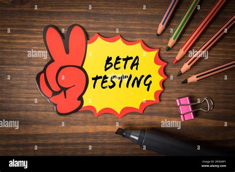 Beta Testing Sticky Note With Text On Wood Texture Background Stock