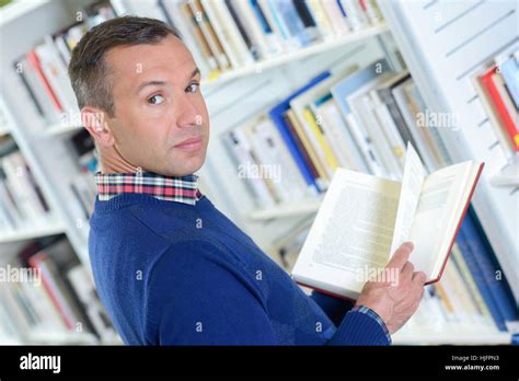 Man Holding A Book Stock Photo Alamy