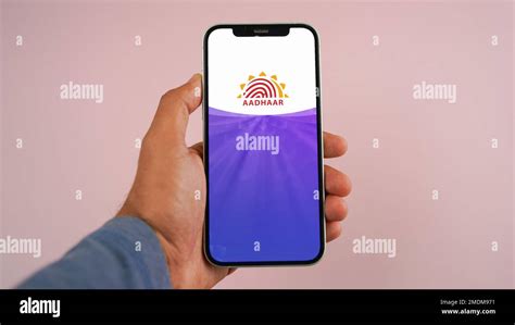 Aadhaar Or Maadhaar Is A Mobile Phone App On The Colour Background