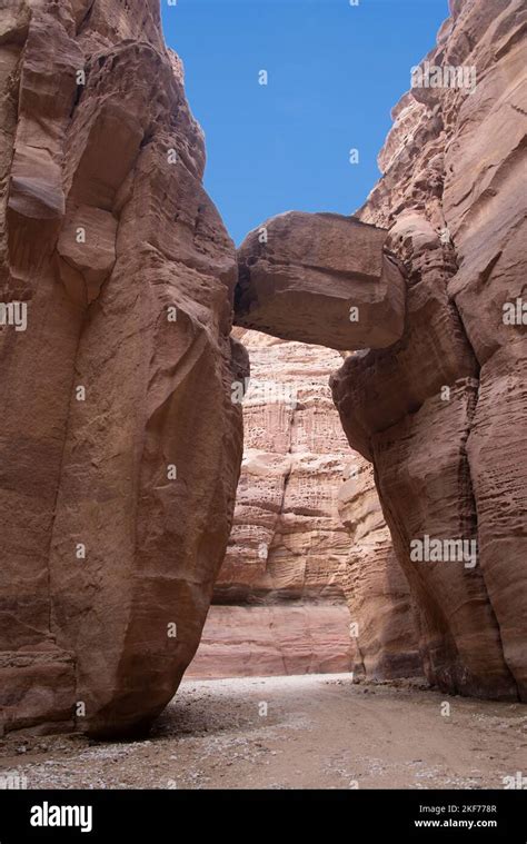 Enormous Hanging Rock Between Two Sides Of A Canyon Wadi Numeira Jordan