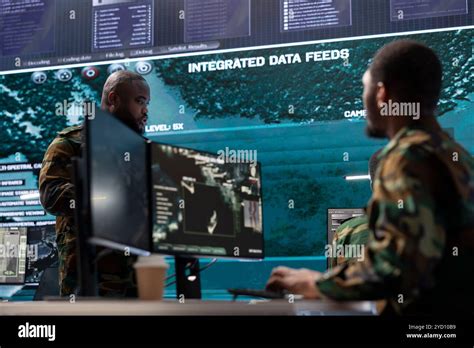 Cybersecurity Team Operates In An Advanced Military Command Center Managing Surveillance