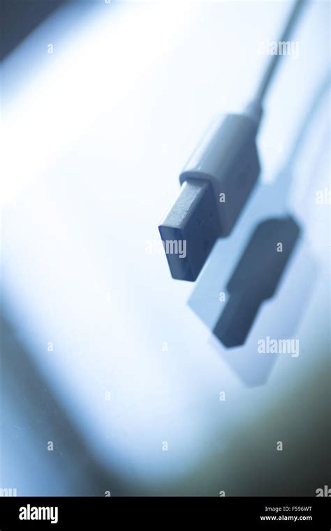 USB Cable IT PC Memory Storage Dongle Plug Socket Close Up Color Artistic Photo In Blue Tones