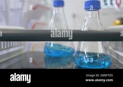 Glass Flasks In The Laboratory Stir The Blue Substance Medical Laboratory Makes Analyzes Glass Flasks In The Laboratory Stir The Blue Substance Medical Laboratory Makes Analyzes