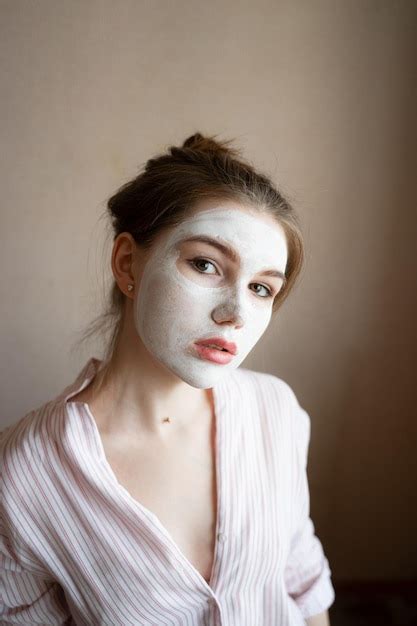 Premium Photo Spanking A Girl With A White Clay Mask On Her Face