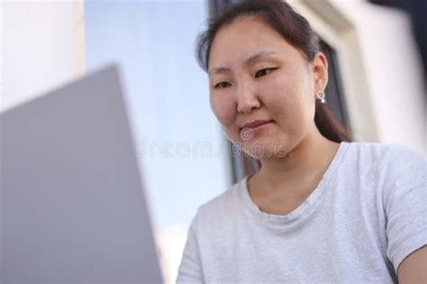 Asian Freelancer Woman Working On Laptop At Home Office Balcony Stock