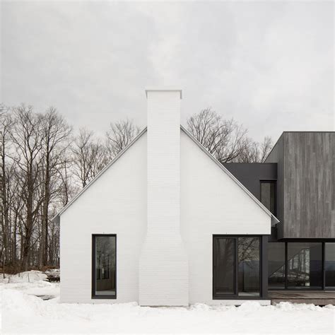 Tba Adds Cedar Clad Extension To White Farmhouse In Quebec