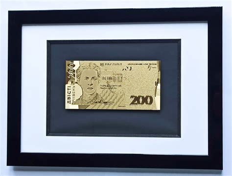 Позолочена банкнота в рамці 200 гривень Монеты Украины и Мира
