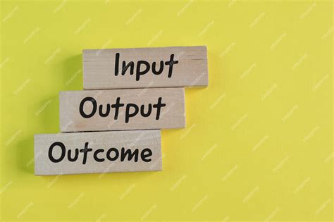Premium Photo Wooden Block With Text Input Output Outcome
