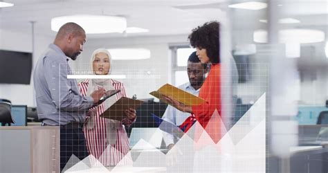 Diverse Team Collaborating In Modern Office With Financial Data