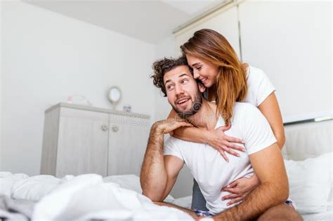 Woman Embracing Her Partner In Bed Happy Couple In Bed Showing Emotions And Love Beautiful