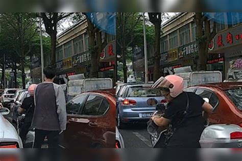 男子车内等红绿灯被骑摩托的女子剐蹭到不料当场逃逸气炸了