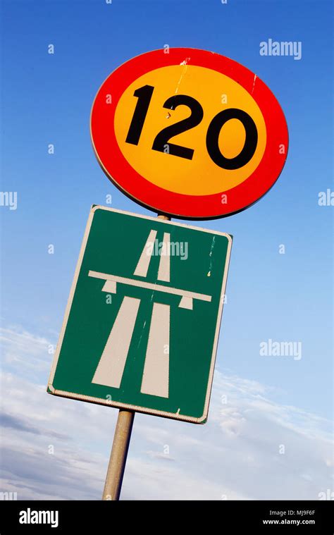 Swedish Road Signs Speed Limit 120 And Motorway On Blue Sky With Clouds
