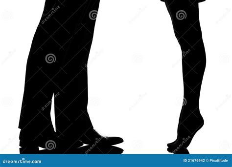 Feet Of A Couple In Bed Under The Blanket Royalty Free Stock