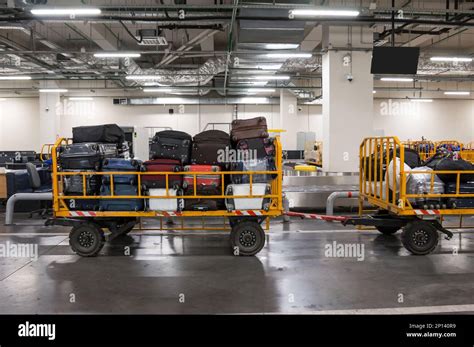Baggage Trolleys With Luggage In The Baggage Compartment Of The Airport