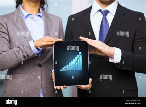 Business Technology Internet And Office Concept Businessman And Businesswoman With Graph On