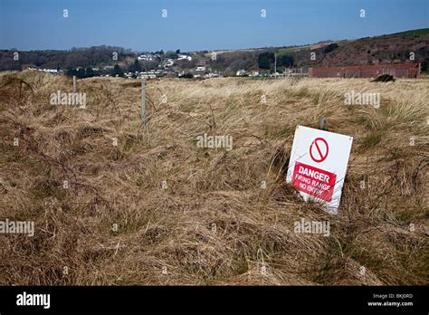 Mod Danger Firing Range No Entry Sign On Barbed Wire Pendine Wales Uk