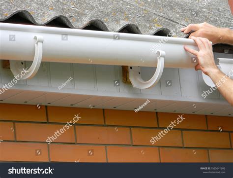 Contractor Installing Plastic Roof Gutter Plastic Stock Photo 1565641606 Shutterstock