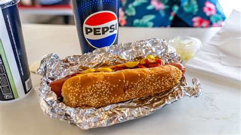 This Ingredient Gives Costco Hot Dogs A Hint Of Sweetness