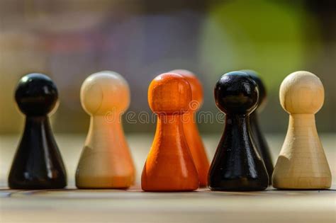 A Collection Of Wooden Chess Pieces Strategically Placed On A Table