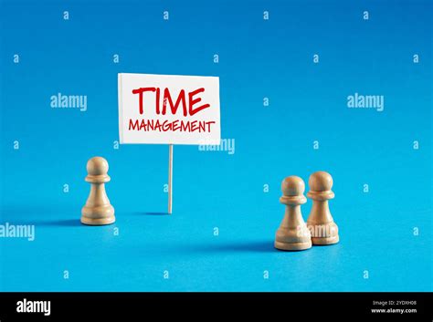 Chess Pawns Standing Next To The Banner With The Word Time Management Managing Time And