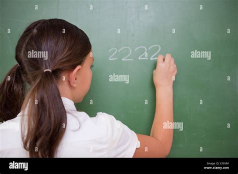 Girl Writing Numbers Stock Photo Alamy