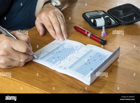 Diabetic Make Notes In His Blood Glucose Test Book Notes About Blood Glucose Levels Diary